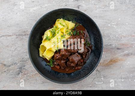 Traditional German braised venison ragout with vegetable and herbs in ...