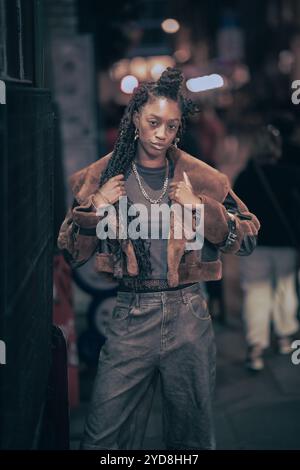 Black female model in Soho at night Stock Photo - Alamy