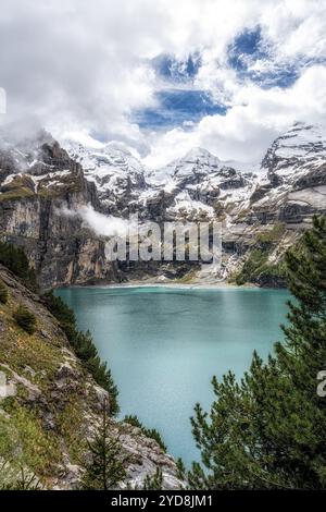 View of Oeschinen lake (Oeschinensee) and Swiss Alps near Kandersteg in ...