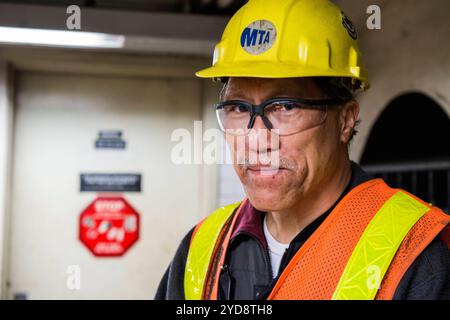 Portrait of a New York City MTA bus driver in front of his bus Stock ...