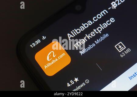In this photo illustration, an Alibaba logo is displayed on a ...