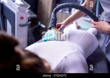 Cosmetician using LPG slimming apparatus on body Stock Photo - Alamy