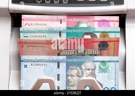 Dominican peso in the counting machine Stock Photo - Alamy
