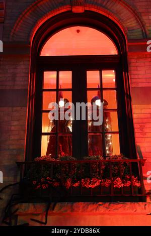 Hand skeleton and webs on red Neon. Halloween decor Stock Photo - Alamy