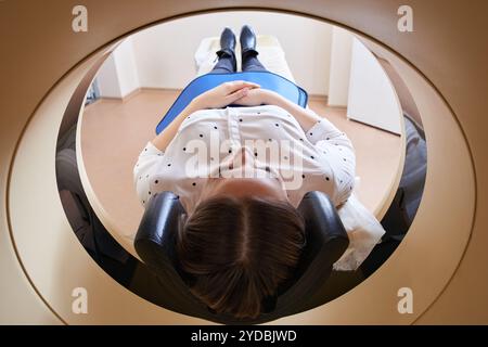 Female patient undergoing MRI - Magnetic resonance imaging in Hospital ...