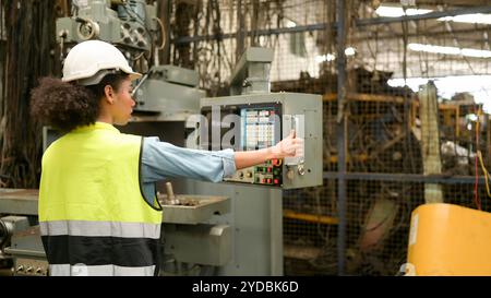 Portrait of female chief engineer in modern industrial factory using ...