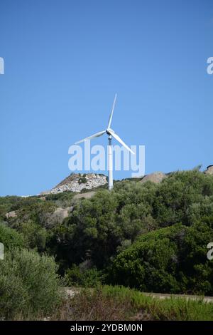 Wind turbines against the blue Sardinian sky, harnessing Mediterranean ...