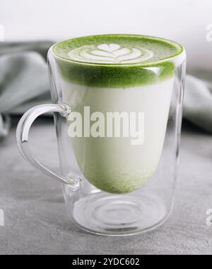 Close-up of iced matcha latte in a plastic to-go cup with Stonemill ...
