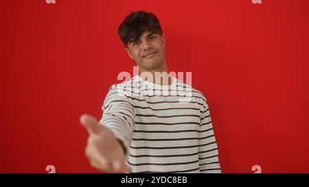 Portrait of handsome cheery trendy red-haired guy using laptop showing ...