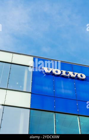 Volvo brand logo on bright blue sky background Stock Photo - Alamy
