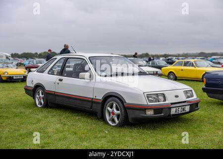 The white Ford Sierra XR4I sports car in white with a blue line Stock ...