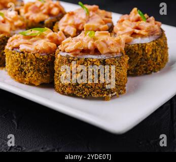 Fried hot sushi rolls on a wooden board Stock Photo - Alamy