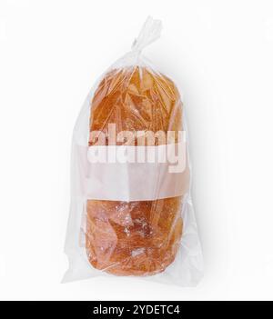 A loaf of bread wrapped in cellophane on an isolated white background ...