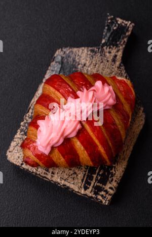 Crispy fresh red croissant with cream and strawberries Stock Photo - Alamy