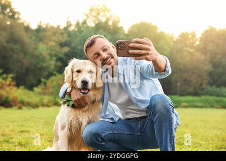 Dog owner taking selfie with cute lying pug, making photos on mobile ...