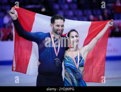 Deanna Stellato-Dudek and Maxime Deschamps of Canada compete during the ...