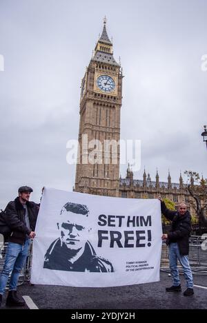 Protestors hold a banner during the Unite Against Digital ID Protest ...