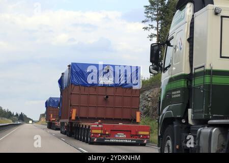 Back view Trucks Lorries & articulated flat bed trailers overtaking ...