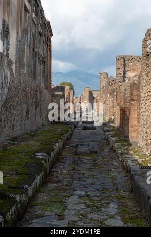 Narrow paved street with stepping stones showing wagon and chariot ...