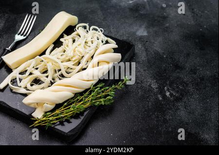 Assortiment of Traditional Caucasian Chechil white cheese on black ...
