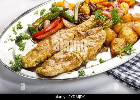 Roasted shark steak with potato and vegetable garnish Stock Photo - Alamy