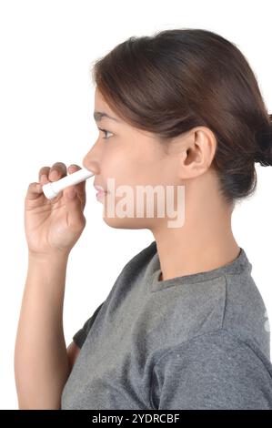 Asian girl holds nose inhaler isolated on white background Stock Photo ...