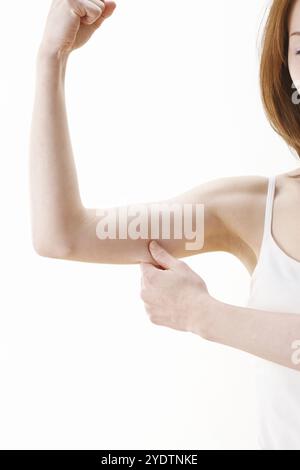 Pinching two arms Stock Photo - Alamy
