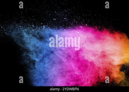 Abstract multi colored powder explosion on white background. Freeze ...