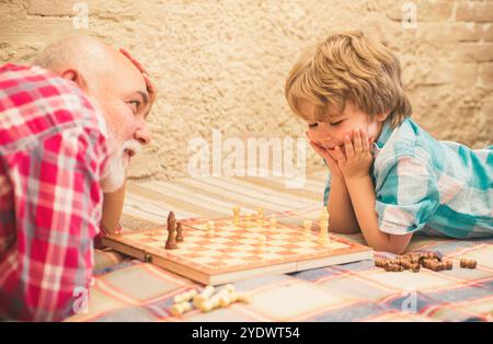 Grandson playing chess with grandpa. Games and activities for children ...