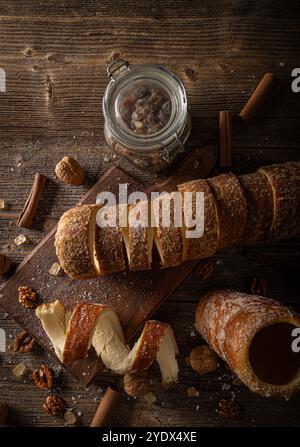 Traditional Hungarian spit cinnamon, chimney cake is rotate for equal ...