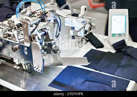 Automatic slit pocket in frame making sewing machine Stock Photo - Alamy