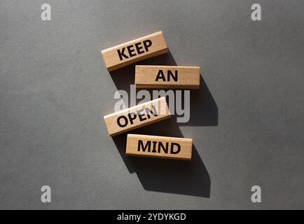 Keep an open mind symbol. Wooden blocks with words Keep an open mind ...