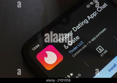 In this photo illustration, a Tinder logo seen displayed on a ...