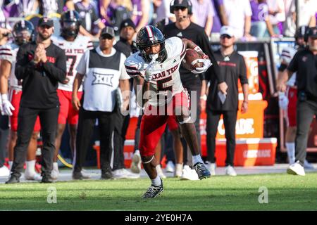 Texas Tech wide receiver Caleb Douglas (5) breaks the tackle attempt by ...