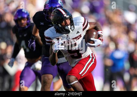 Texas Tech wide receiver Caleb Douglas (5) breaks the tackle attempt by ...