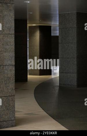 Colonnade of a contemporary building with concrete columns decorated ...