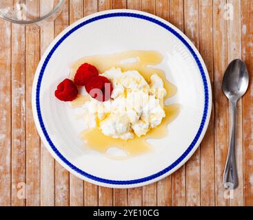 Mato cheese with raspberry and honey Stock Photo - Alamy