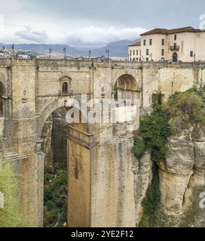 Rocky landscape of Ronda city with Puente Nuevo Bridge and buildings ...