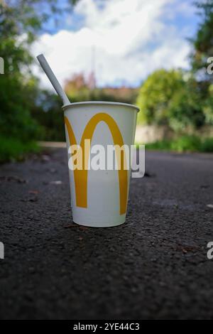 Discarded soft drink with straw Stock Photo - Alamy