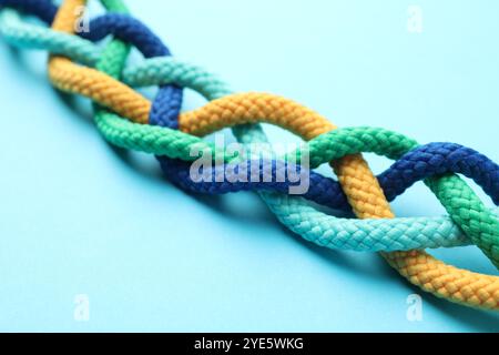 Braided ropes on color background Stock Photo - Alamy