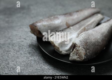 Frozen hake fishes on grey table, top view Stock Photo - Alamy