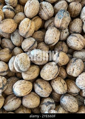 Natural Walnuts with shell a lot in farmer shop. Top view Stock Photo ...
