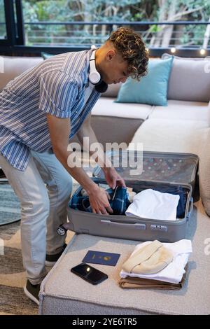 Young man preparing for journey at the home Stock Photo - Alamy