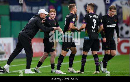 From left: Eric Smith, Karol Mets, Christian Eriksen (Wolfsburg ...