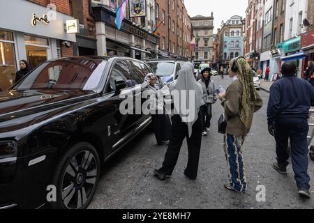 Middle eastern tourists take selfie's outside their luxury vehicle ...