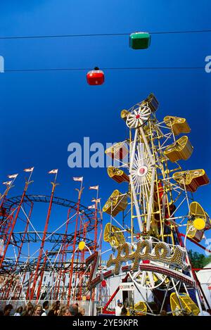 People ride a roller coaster as Canada soccer fans watch their team ...