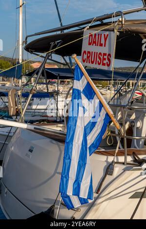 Yacht with Greek flag in Mediterranean sea on a pink sunrise Stock ...