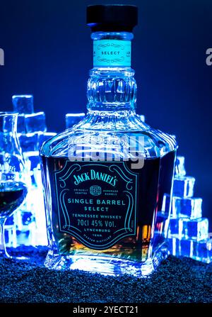 Jack Daniels Single Barrel whiskey bottle and shot glass on table Stock ...
