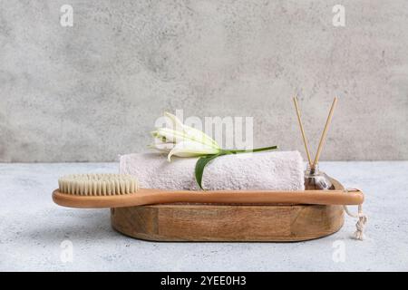 Spa composition with aroma diffuser and lily flowers close-up Stock ...