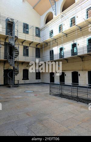 Spiral metal stairway and upper floors seen from the main hall at ...